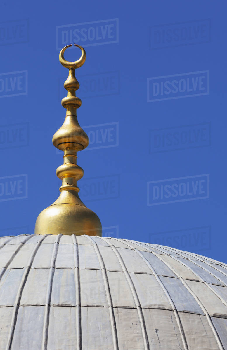 Islamic spire on top of the dome roof of a mosque; Istanbul, Turkey ...